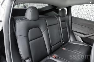 Black Tesla Model Y 2022 in Riga, with an engine capacity of 0.00 L and mileage of 88 thousand km for 39750 €, photo 19 on AUTOMOTO.COM.LV