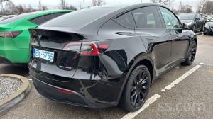 Black Tesla Model Y 2022 in Riga, with an engine capacity of 0.00 L and mileage of 50 thousand km for 33000 €, photo 3 on AUTOMOTO.COM.LV
