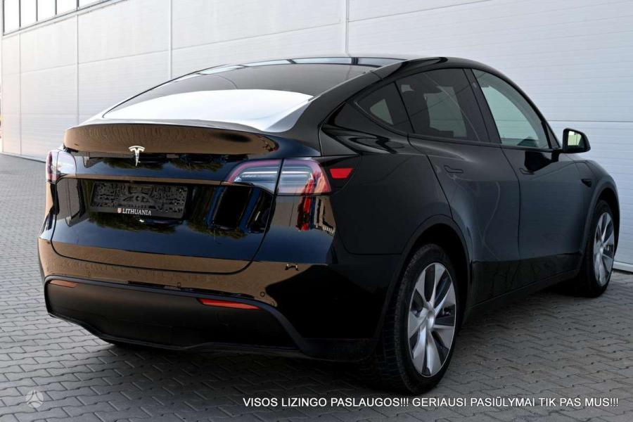 Black Tesla Model Y 2022 in Kretinga, with an engine capacity of 0.00 L and mileage of 70 thousand km for 28699 €, photo 11 on AUTOMOTO.COM.LV