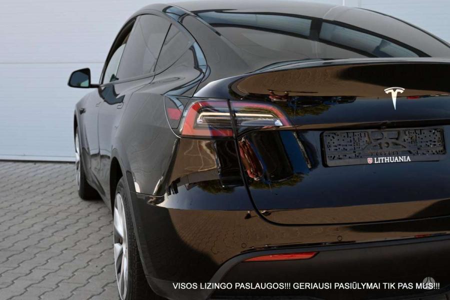 Black Tesla Model Y 2022 in Kretinga, with an engine capacity of 0.00 L and mileage of 70 thousand km for 28699 €, photo 14 on AUTOMOTO.COM.LV