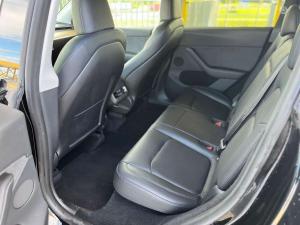 Black Tesla Model Y 2022 in Vilnius, with an engine capacity of 0.00 L and mileage of 115 thousand km for 32999 €, photo 14 on AUTOMOTO.COM.LV