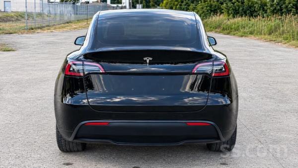 Black Tesla Model Y 2022 in Riga, with an engine capacity of 0.00 L and mileage of 138 thousand km for 26500 €, photo 6 on AUTOMOTO.COM.LV
