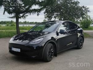 Melns Tesla Model Y 2023 Rīga, ar dzinēja tilpumu 0.00 L un nobraukumu 100 tūkst. km par 28000 €, foto  vietnē AUTOMOTO.COM.LV