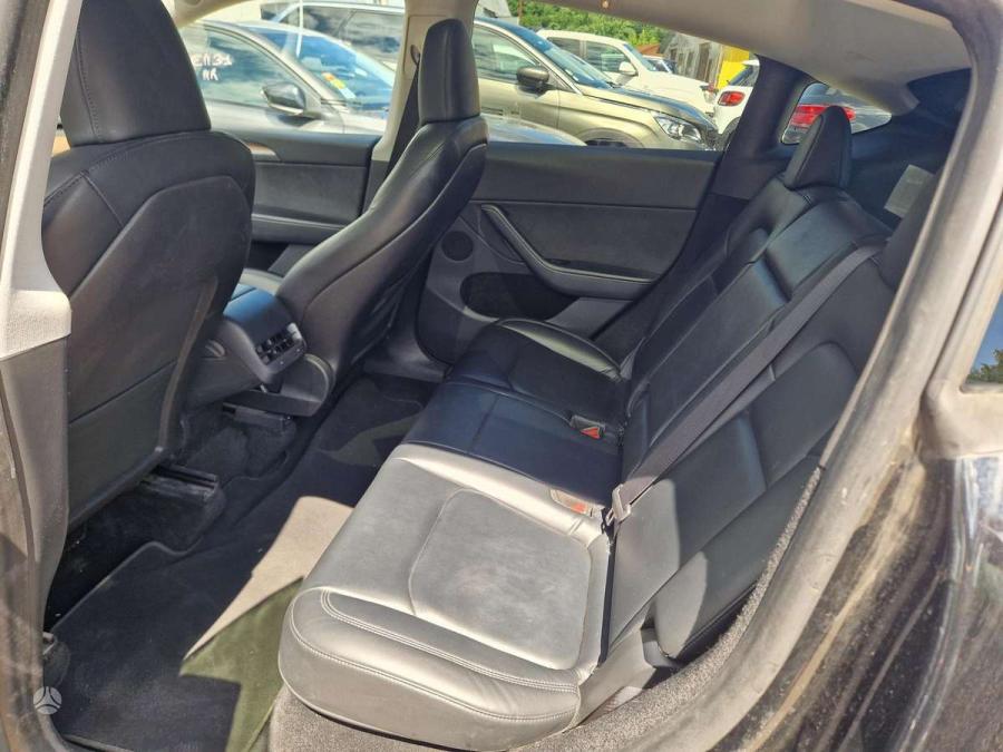 Black Tesla Model Y 2023 in Kaunas, with an engine capacity of 0.00 L and mileage of 305 thousand km for 21000 €, photo 6 on AUTOMOTO.COM.LV