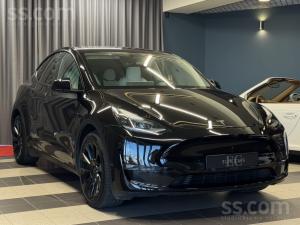 Black Tesla Model Y 2023 in Riga, with an engine capacity of 0.00 L and mileage of 60 thousand km for 35990 €, photo 4 on AUTOMOTO.COM.LV