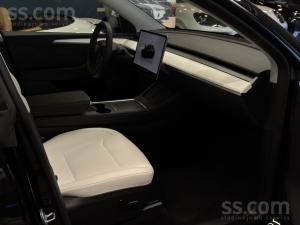 Black Tesla Model Y 2023 in Riga, with an engine capacity of 0.00 L and mileage of 60 thousand km for 35990 €, photo 11 on AUTOMOTO.COM.LV
