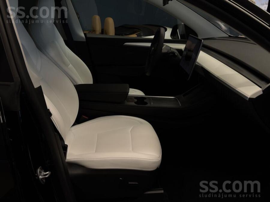 Black Tesla Model Y 2023 in Riga, with an engine capacity of 0.00 L and mileage of 60 thousand km for 35990 €, photo 12 on AUTOMOTO.COM.LV