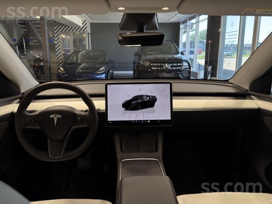 Black Tesla Model Y 2023 in Riga, with an engine capacity of 0.00 L and mileage of 60 thousand km for 35990 €, photo 14 on AUTOMOTO.COM.LV