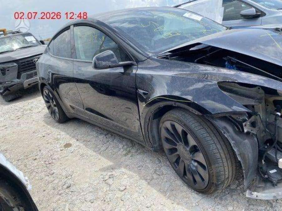 Black Tesla Model Y 2023 in Klaipeda, with an engine capacity of 0.00 L and mileage of 51 thousand km for 18876 €, photo 3 on AUTOMOTO.COM.LV