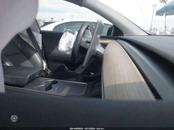 Black Tesla Model Y 2023 in Siauliai, with an engine capacity of 0.00 L and mileage of 78 thousand km for 19400 €, photo 6 on AUTOMOTO.COM.LV