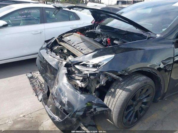Black Tesla Model Y 2023 in Siauliai, with an engine capacity of 0.00 L and mileage of 78 thousand km for 19400 €, photo 7 on AUTOMOTO.COM.LV