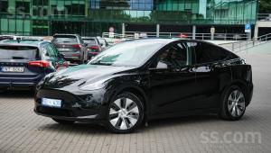Black Tesla Model Y 2023 in Riga, with an engine capacity of 0.00 L and mileage of 87 thousand km for 31950 €, photo  on AUTOMOTO.COM.LV