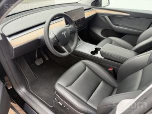 Black Tesla Model Y 2023 in Riga, with an engine capacity of 0.00 L and mileage of 66 thousand km for 36500 €, photo 7 on AUTOMOTO.COM.LV