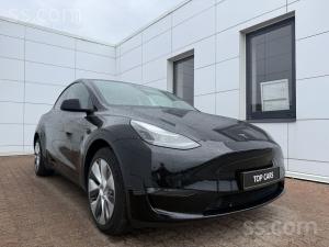 Black Tesla Model Y 2023 in Riga, with an engine capacity of 0.00 L and mileage of 54 thousand km for 38500 €, photo 3 on AUTOMOTO.COM.LV