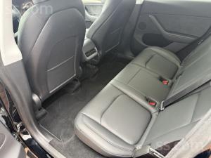 Black Tesla Model Y 2023 in Riga, with an engine capacity of 0.00 L and mileage of 54 thousand km for 38500 €, photo 14 on AUTOMOTO.COM.LV