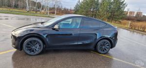 Black Tesla Model Y 2024 in Vilnius, with an engine capacity of 0.00 L and mileage of 25 thousand km for 28500 €, photo 3 on AUTOMOTO.COM.LV