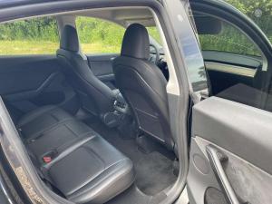 Black Tesla Model Y 2024 in Vilnius, with an engine capacity of 0.00 L and mileage of 195 thousand km for 25900 €, photo 24 on AUTOMOTO.COM.LV