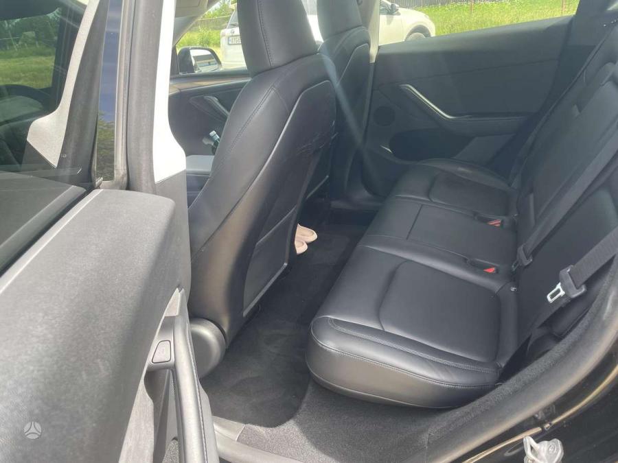 Black Tesla Model Y 2024 in Vilnius, with an engine capacity of 0.00 L and mileage of 195 thousand km for 25900 €, photo 30 on AUTOMOTO.COM.LV