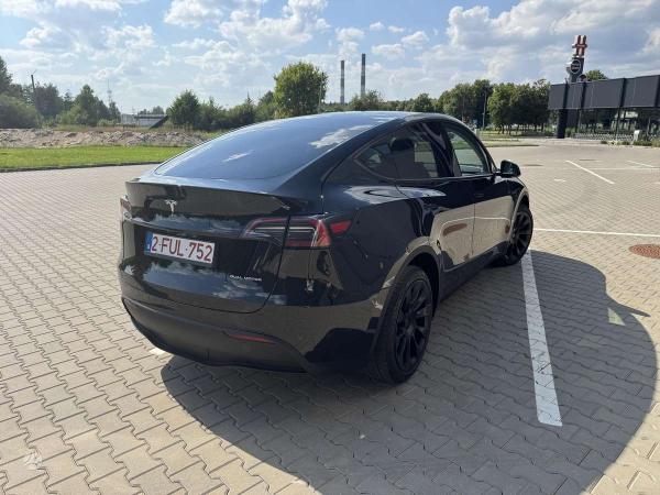 Black Tesla Model Y 2024 in Kaunas, with an engine capacity of 0.00 L and mileage of 42 thousand km for 35000 €, photo 4 on AUTOMOTO.COM.LV