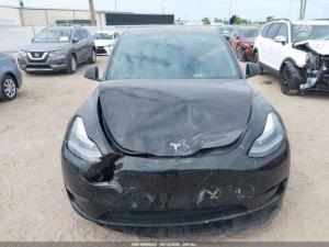 Black Tesla Model Y 2024 in Klaipeda, with an engine capacity of 0.00 L and mileage of 80 thousand km for 21100 €, photo 4 on AUTOMOTO.COM.LV