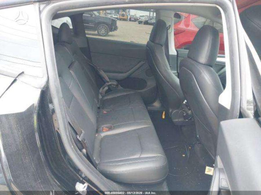 Black Tesla Model Y 2024 in Klaipeda, with an engine capacity of 0.00 L and mileage of 80 thousand km for 21100 €, photo 12 on AUTOMOTO.COM.LV