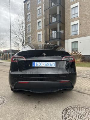 Black Tesla Model Y 2022 in Riga, with an engine capacity of 0.00 L and mileage of 107 thousand km for 31000 €, photo 6 on AUTOMOTO.COM.LV