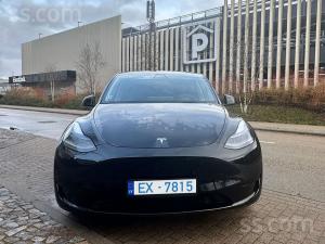 Black Tesla Model Y 2022 in Riga, with an engine capacity of 0.00 L and mileage of 100 thousand km for 31000 €, photo 2 on AUTOMOTO.COM.LV