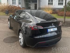 Black Tesla Model Y 2022 in Riga, with an engine capacity of 0.00 L and mileage of 100 thousand km for 31000 €, photo 12 on AUTOMOTO.COM.LV