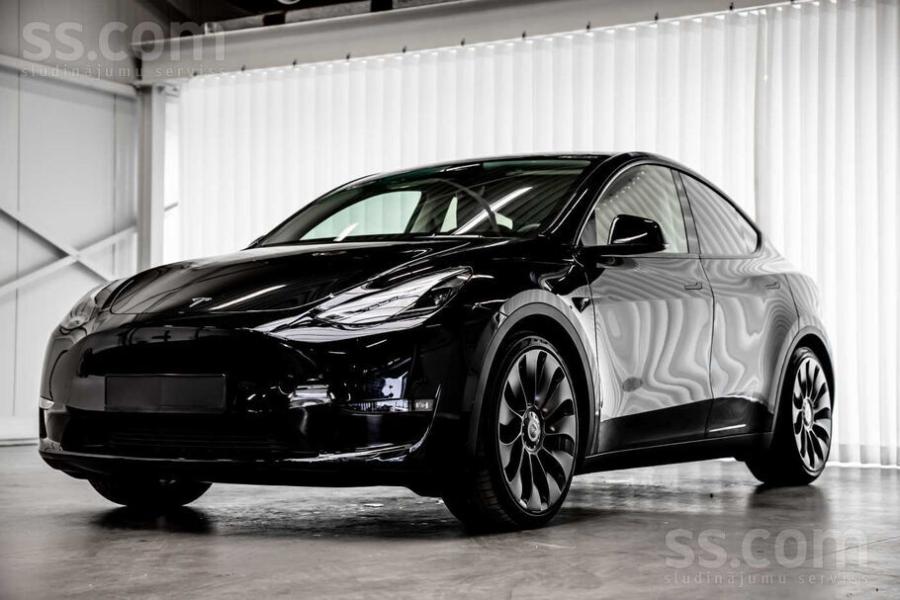 Black Tesla Model Y 2022 in Tukums, with an engine capacity of 0.00 L and mileage of 84 thousand km for 37990 €, photo 1 on AUTOMOTO.COM.LV
