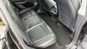 Black Tesla Model Y 2022 in Jonava, with an engine capacity of 0.00 L and mileage of 128 thousand km for 22650 €, photo 19 on AUTOMOTO.COM.LV