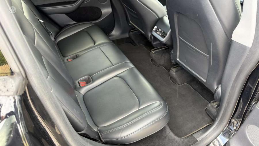 Black Tesla Model Y 2022 in Jonava, with an engine capacity of 0.00 L and mileage of 128 thousand km for 22650 €, photo 19 on AUTOMOTO.COM.LV