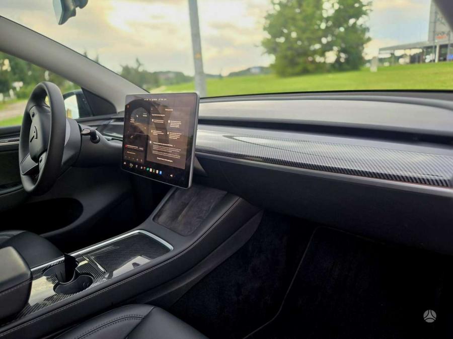 Black Tesla Model Y 2022 in Vilnius, with an engine capacity of 0.00 L and mileage of 80 thousand km for 31000 €, photo 14 on AUTOMOTO.COM.LV