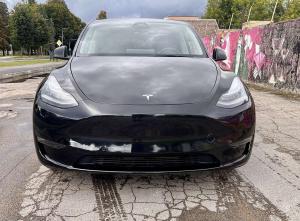 Black Tesla Model Y 2022 in Siauliai, with an engine capacity of 0.00 L and mileage of 58 thousand km for 28900 €, photo  on AUTOMOTO.COM.LV