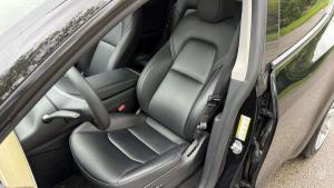 Black Tesla Model Y 2022 in Jonava, with an engine capacity of 0.00 L and mileage of 128 thousand km for 19750 €, photo 18 on AUTOMOTO.COM.LV