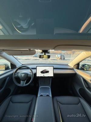 Black Tesla Model Y 2023 in Parnu, with an engine capacity of 0.00 L and mileage of 30 thousand km for 34990 €, photo 5 on AUTOMOTO.COM.LV