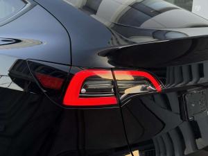 Black Tesla Model Y 2023 in Vilnius, with an engine capacity of 0.00 L and mileage of 77 thousand km for 37700 €, photo 10 on AUTOMOTO.COM.LV