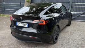 Black Tesla Model Y 2023 in Jonava, with an engine capacity of 0.00 L and mileage of 130 thousand km for 22750 €, photo 14 on AUTOMOTO.COM.LV
