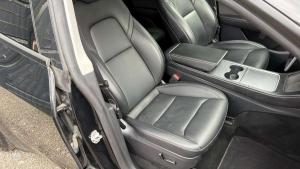 Black Tesla Model Y 2023 in Jonava, with an engine capacity of 0.00 L and mileage of 130 thousand km for 22750 €, photo 20 on AUTOMOTO.COM.LV