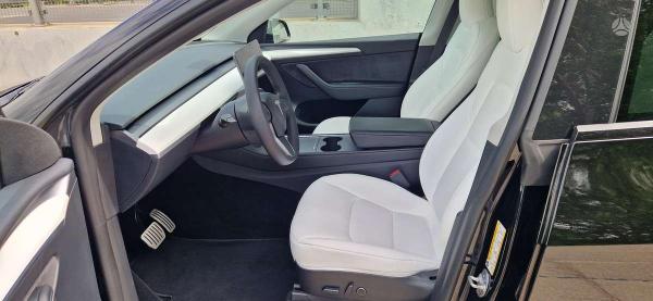 Black Tesla Model Y 2023 in Marijampole, with an engine capacity of 0.00 L and mileage of 84 thousand km for 25900 €, photo 9 on AUTOMOTO.COM.LV