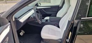 Black Tesla Model Y 2023 in Marijampole, with an engine capacity of 0.00 L and mileage of 84 thousand km for 25900 €, photo 9 on AUTOMOTO.COM.LV