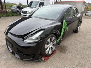 Black Tesla Model Y 2023 in Marijampole, with an engine capacity of 0.00 L and mileage of 84 thousand km for 23595 €, photo  on AUTOMOTO.COM.LV