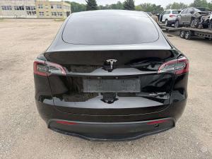 Black Tesla Model Y 2023 in Marijampole, with an engine capacity of 0.00 L and mileage of 84 thousand km for 23595 €, photo 6 on AUTOMOTO.COM.LV