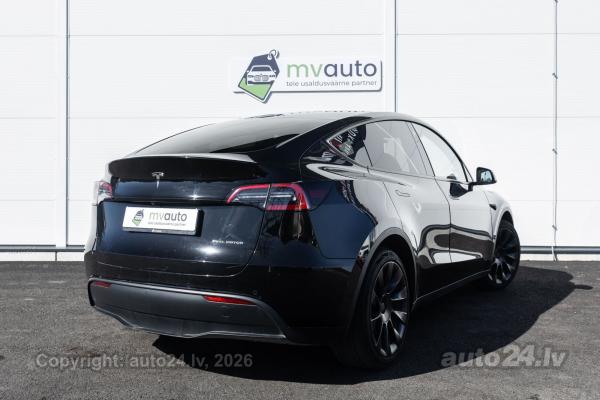 Black Tesla Model Y 2022 in Tallinn, with an engine capacity of 0.00 L and mileage of 73 thousand km for 31990 €, photo 6 on AUTOMOTO.COM.LV