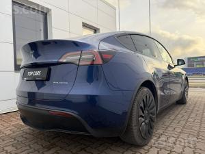 Blue Tesla Model Y 2022 in Riga, with an engine capacity of 0.00 L and mileage of 123 thousand km for 28900 €, photo 5 on AUTOMOTO.COM.LV
