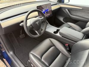 Blue Tesla Model Y 2022 in Riga, with an engine capacity of 0.00 L and mileage of 123 thousand km for 28900 €, photo 6 on AUTOMOTO.COM.LV