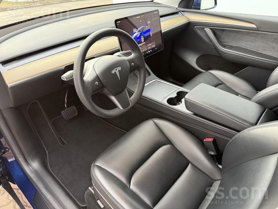 Blue Tesla Model Y 2022 in Riga, with an engine capacity of 0.00 L and mileage of 123 thousand km for 28900 €, photo 6 on AUTOMOTO.COM.LV