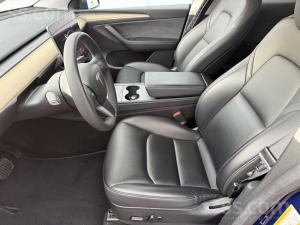 Blue Tesla Model Y 2022 in Riga, with an engine capacity of 0.00 L and mileage of 123 thousand km for 28900 €, photo 7 on AUTOMOTO.COM.LV