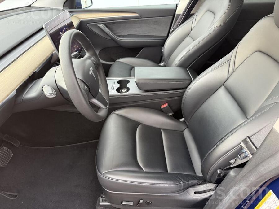 Blue Tesla Model Y 2022 in Riga, with an engine capacity of 0.00 L and mileage of 123 thousand km for 28900 €, photo 7 on AUTOMOTO.COM.LV