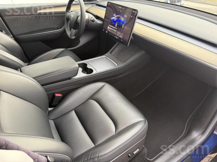Blue Tesla Model Y 2022 in Riga, with an engine capacity of 0.00 L and mileage of 123 thousand km for 28900 €, photo 9 on AUTOMOTO.COM.LV