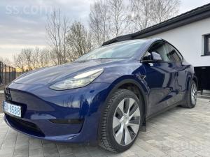 Blue Tesla Model Y 2023 in Riga, with an engine capacity of 0.00 L and mileage of 99 thousand km for 30450 €, photo  on AUTOMOTO.COM.LV